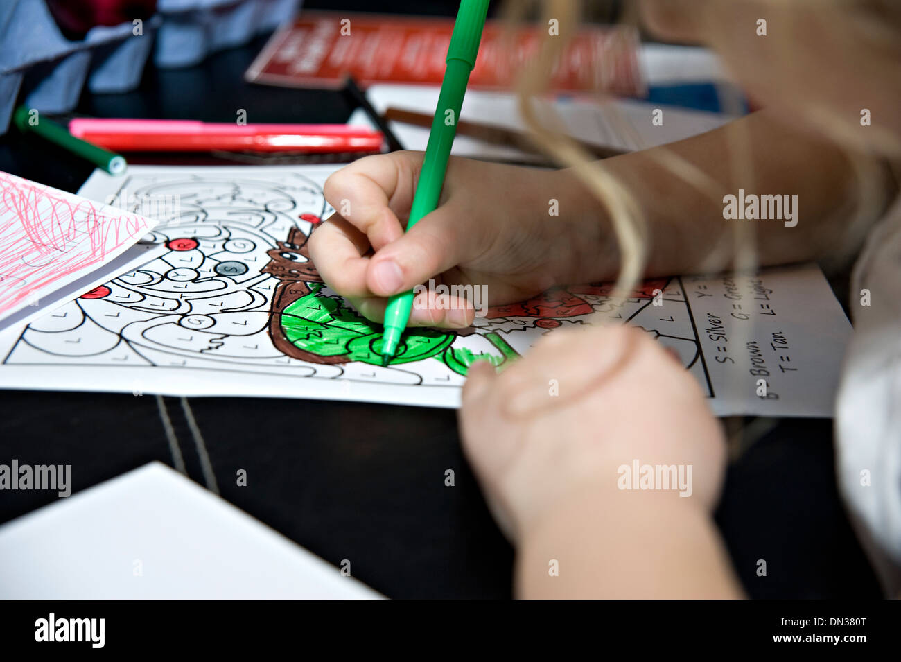 A young girl colouring in Stock Photo - Alamy
