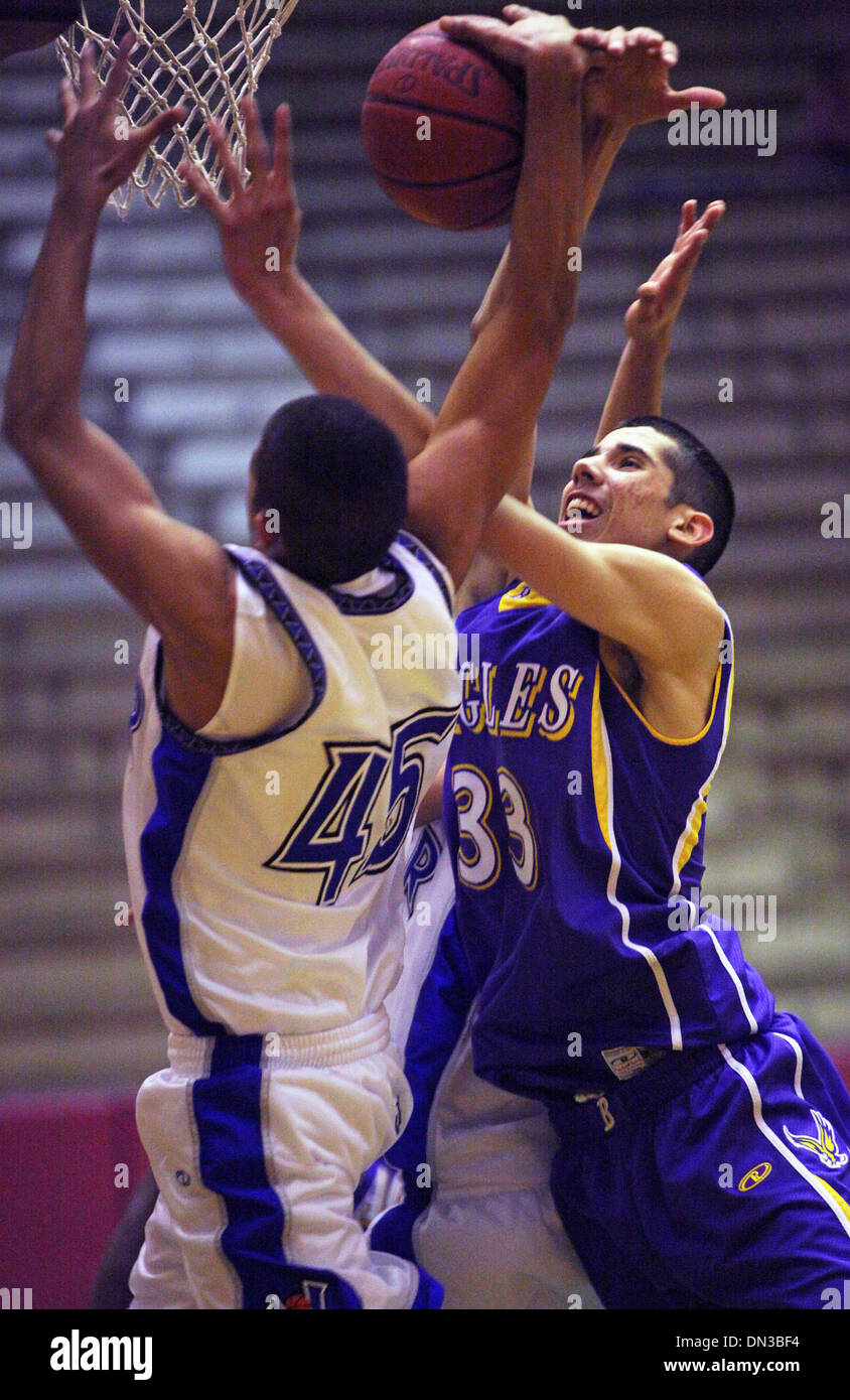 SPORTS Lanier's George DeLeon runs into defense by Brack's Omar ...