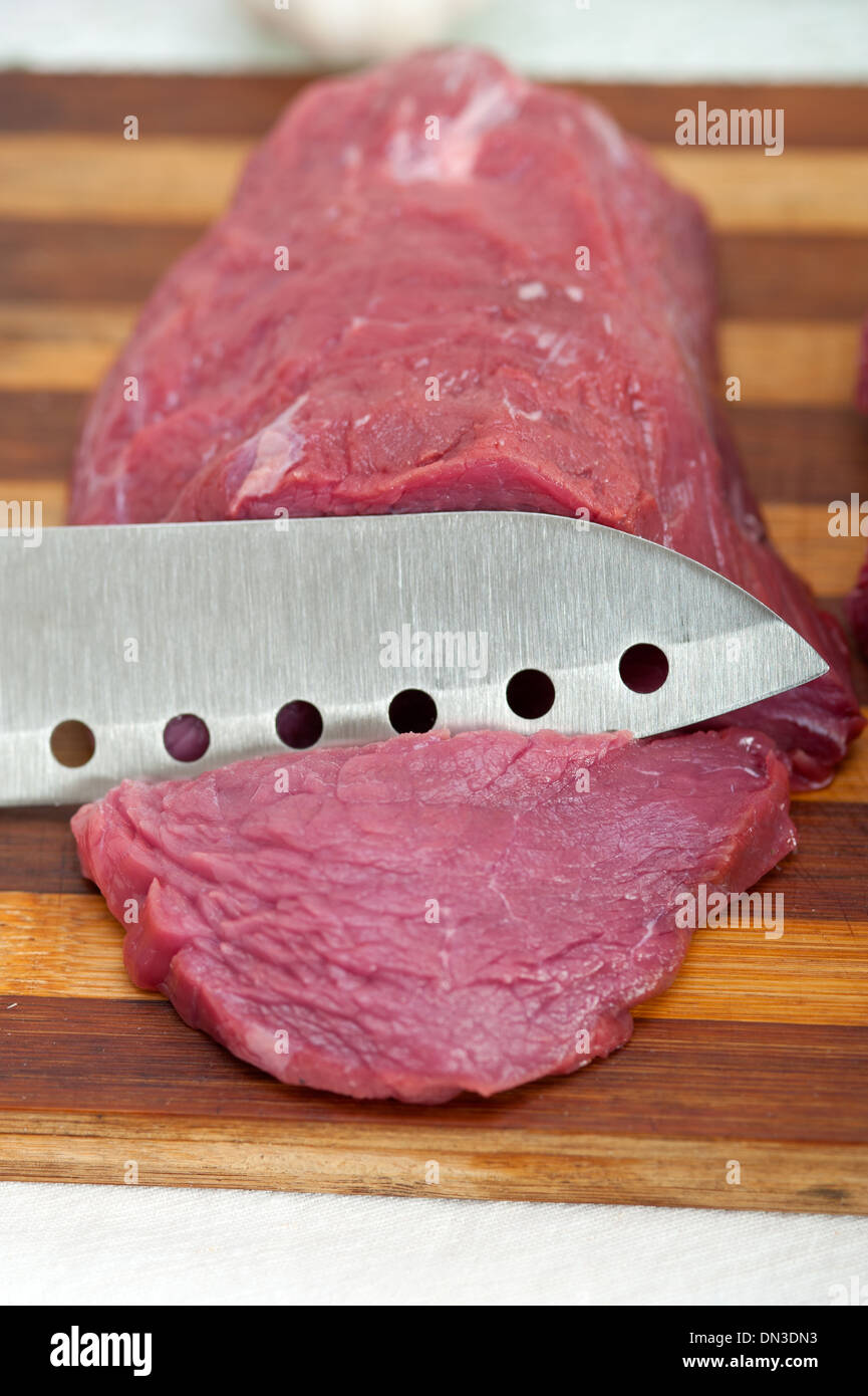raw beef cutting on wood board ready to cook Stock Photo - Alamy