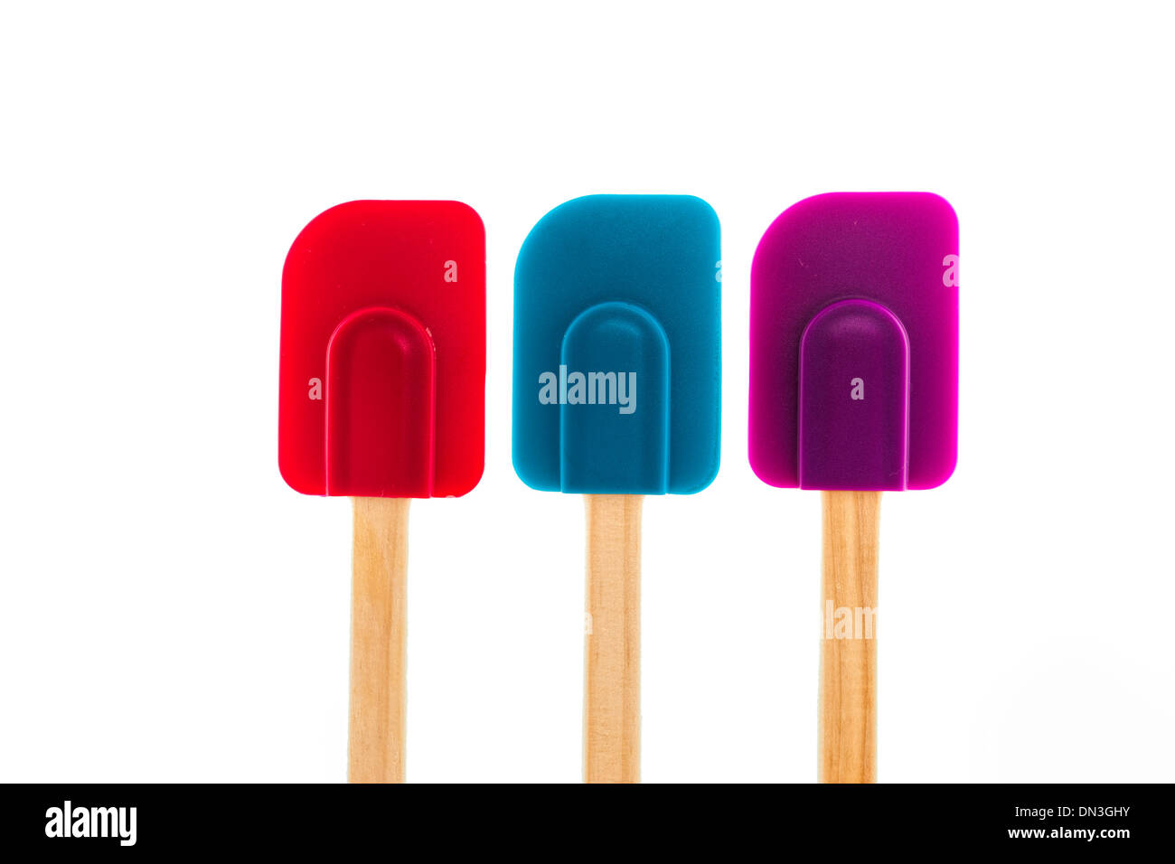 A conceptual image of three different colored spatulas with wooden ...