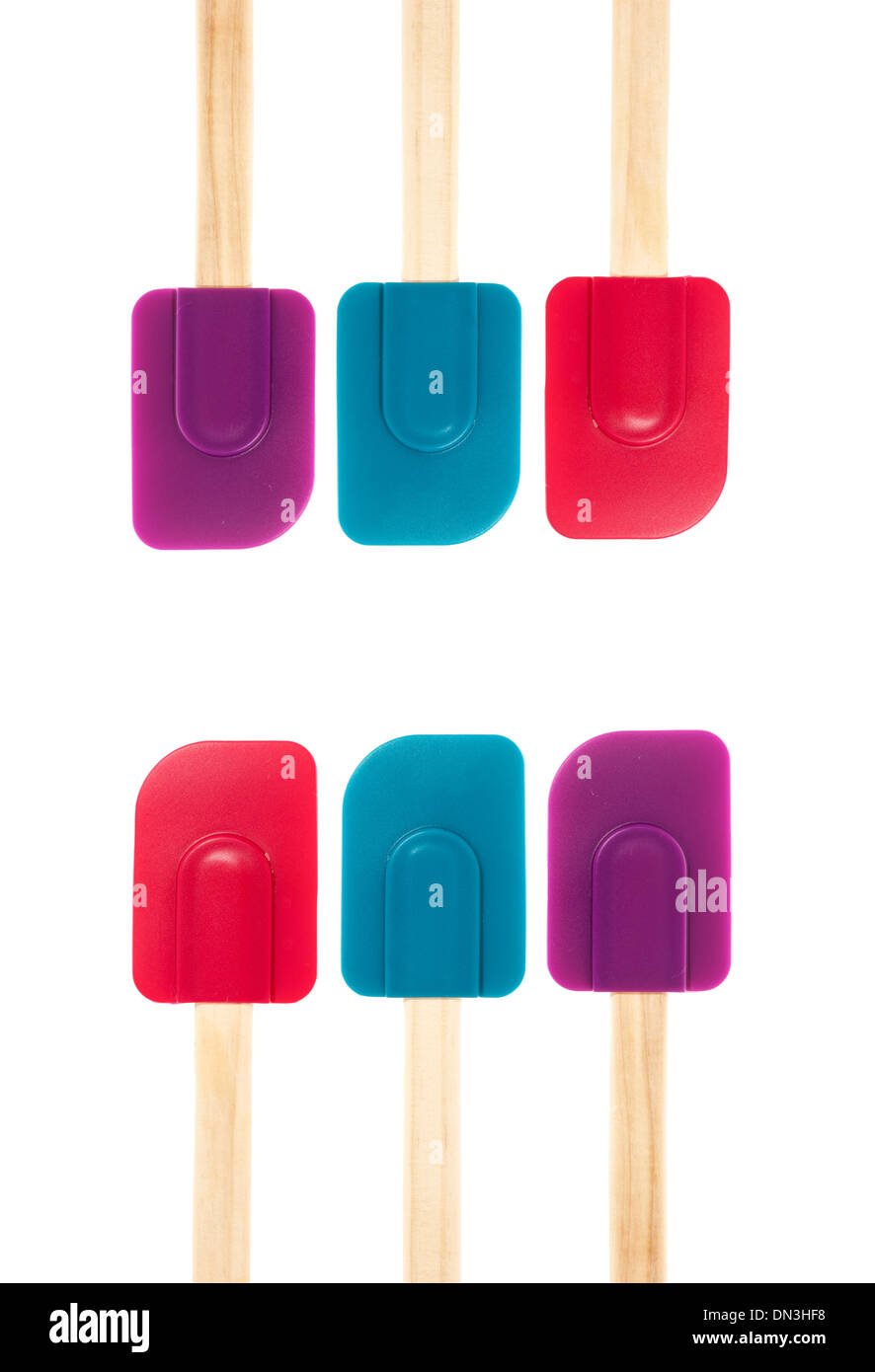 A conceptual image of three different colored spatulas with wooden ...