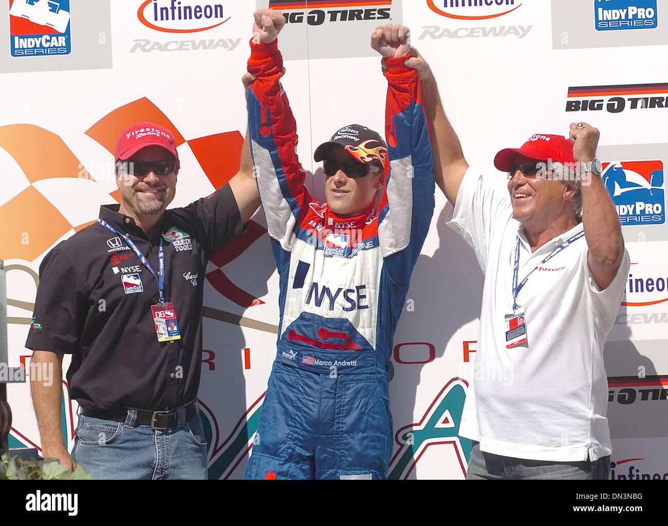 Aug 27, 2006; Sonoma, CA, USA; (L-R) MICHAEL ANDRETTI holds up his son ...
