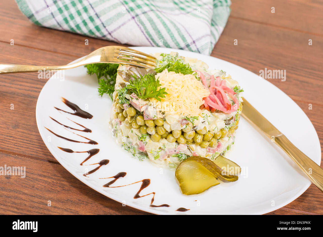 Russian salad with mayonnaise as a ring Stock Photo - Alamy