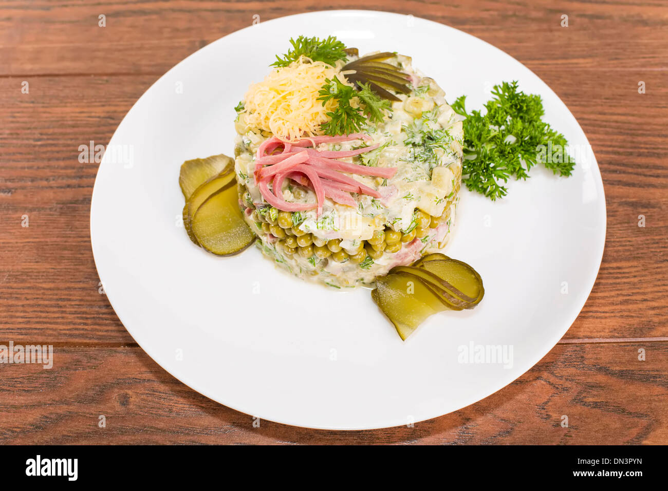 Russian salad with mayonnaise as a ring Stock Photo - Alamy