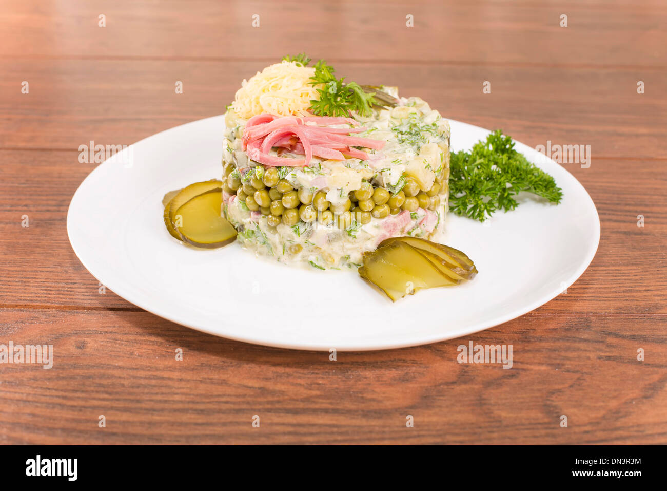 Russian salad with mayonnaise as a ring Stock Photo - Alamy