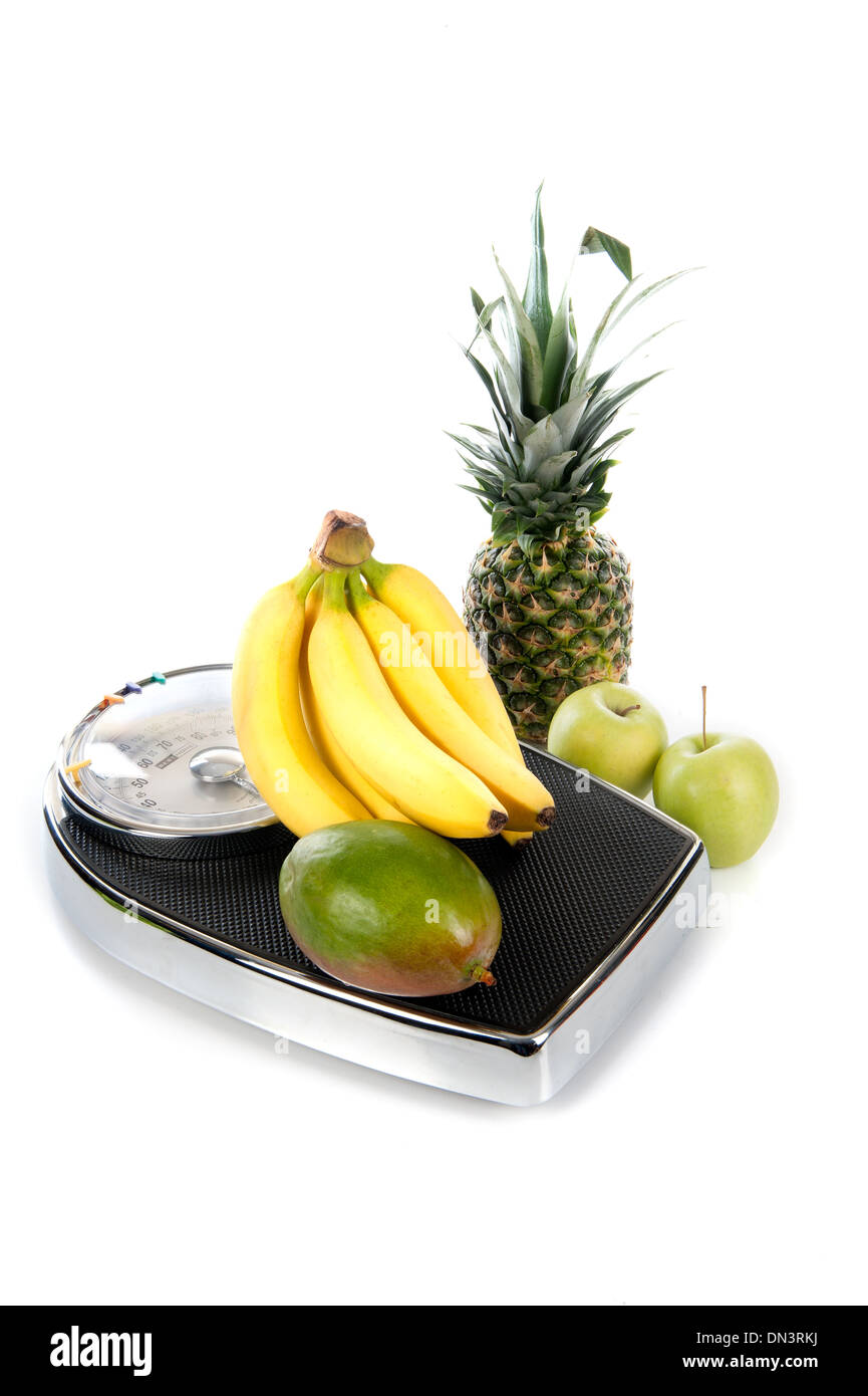 Fruits on weighing scale Cut Out Stock Images & Pictures - Alamy