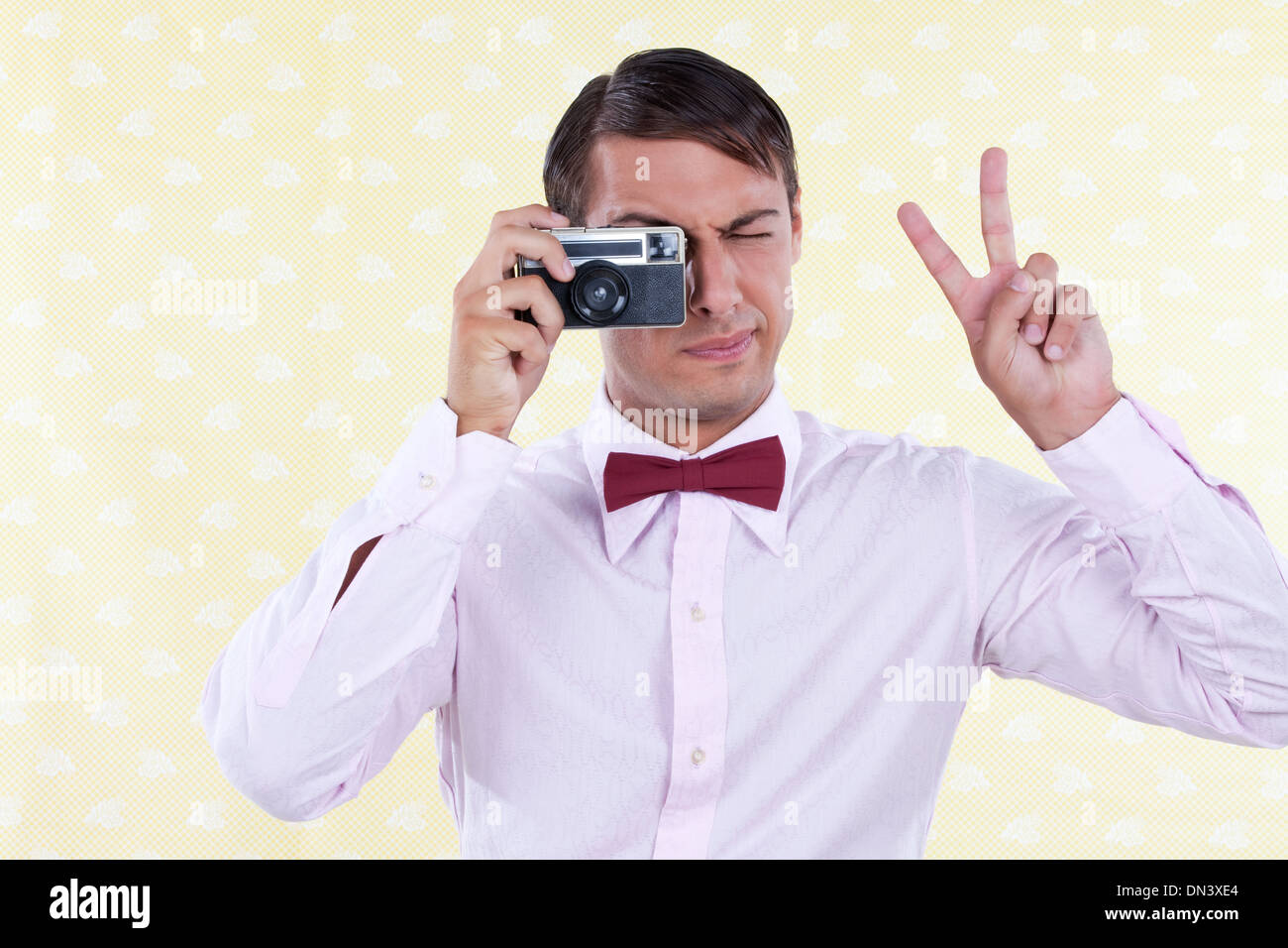 Retro Male Using Old Camera Stock Photo - Alamy