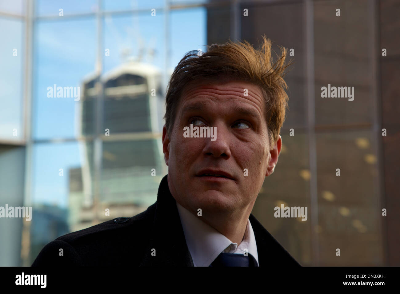 A City of London businessman looking upwards with the "Walkie Talkie ...