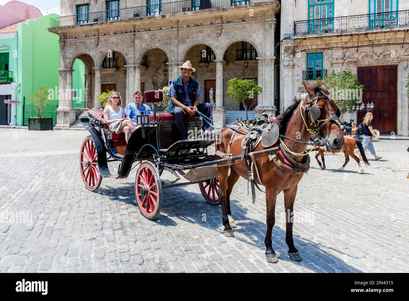 Tourists Taking A Traditional Horse and Carriage Ride, Havana, Cuba ...