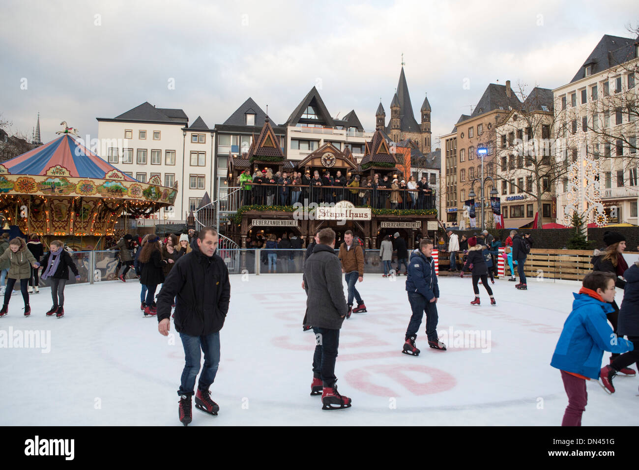 Christmas Market Cologne people skating at an ice rink in the Altstadt ...
