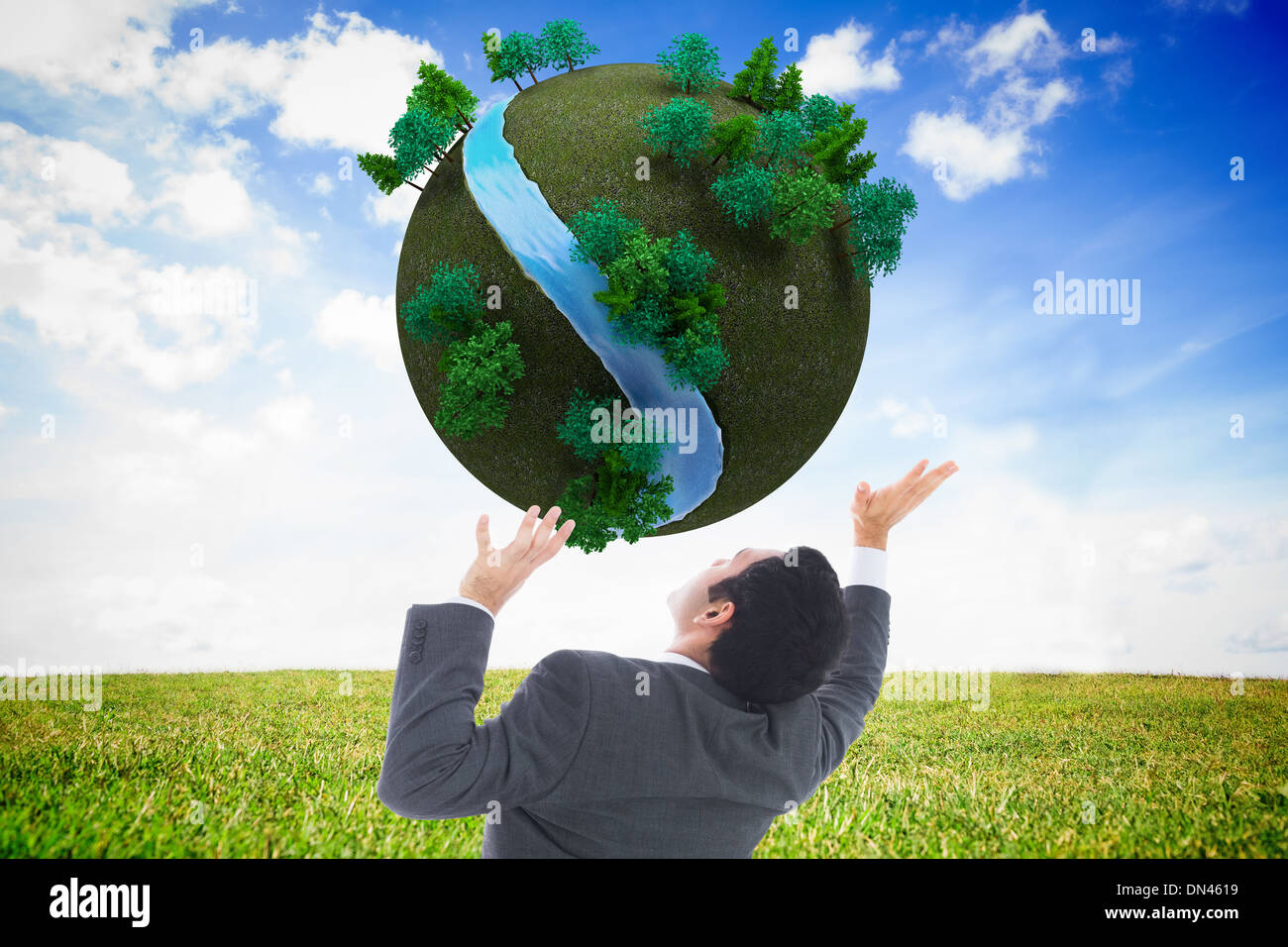 Composite image of businessman with arms raised Stock Photo - Alamy