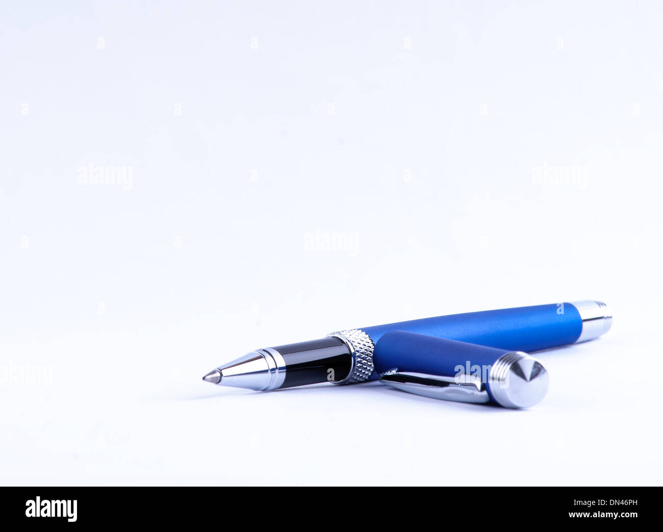 Blue and silver pen on white background Stock Photo - Alamy