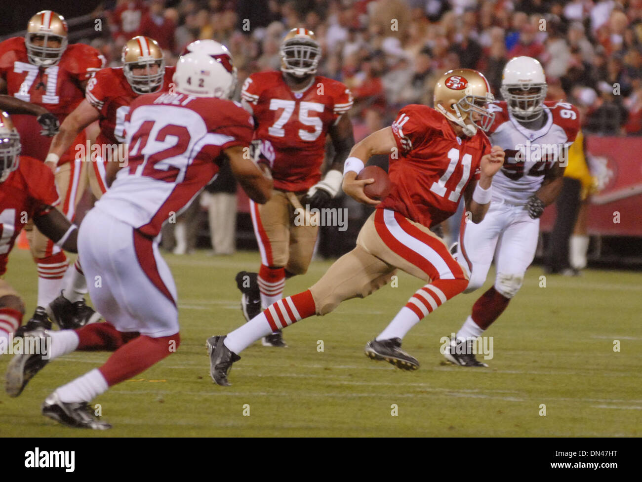 San Francisco Forty Niners quarterback Alex Smith scrambles for a short ...