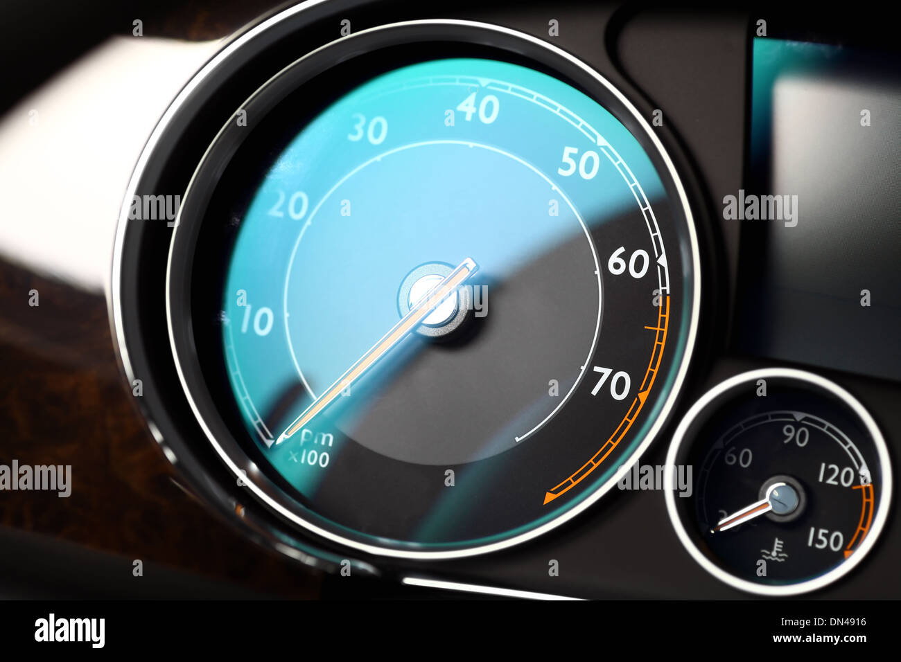 Detail of a tachometer and a coolant temperature gauge in a car Stock ...