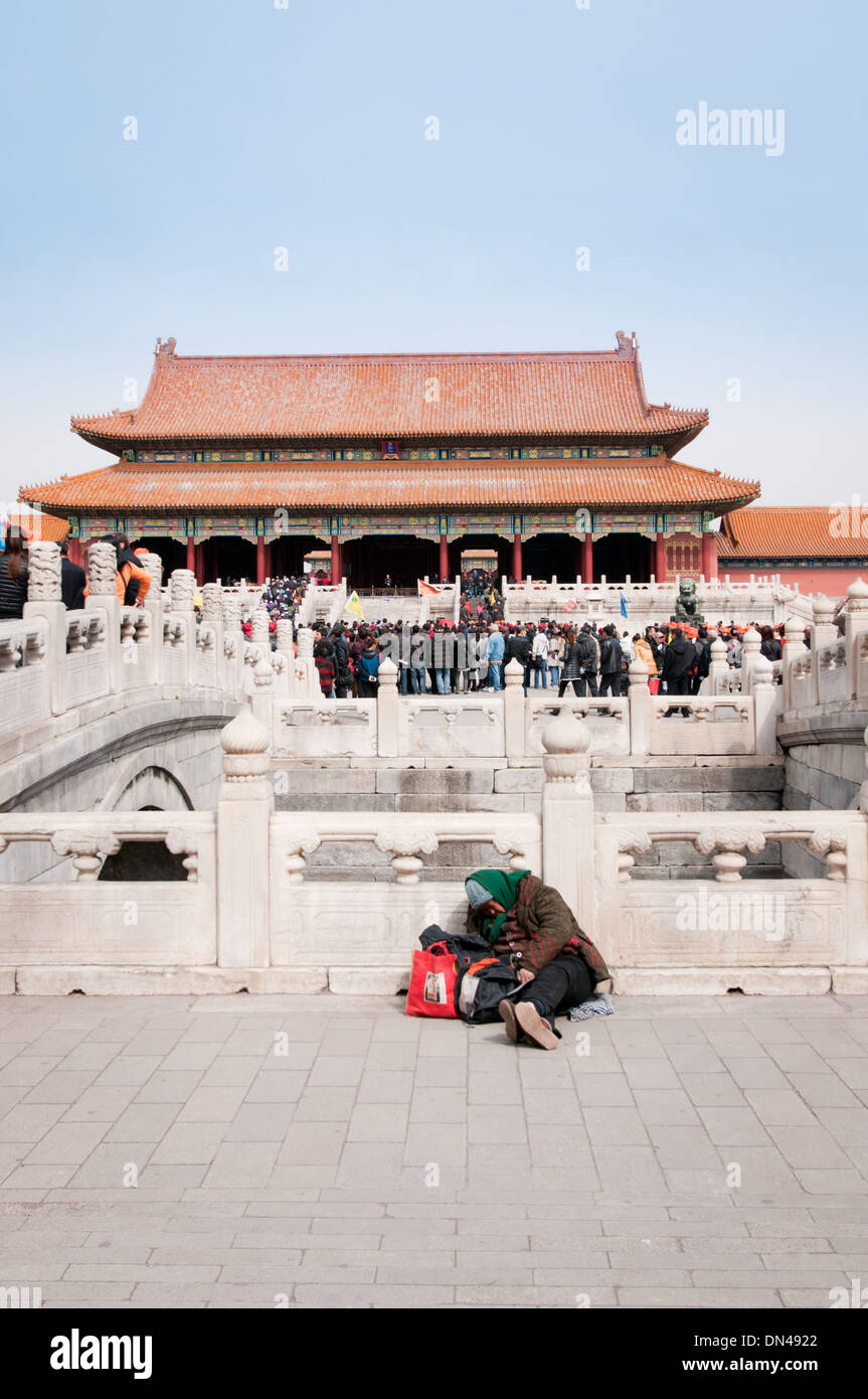 Homeless woman sleeping next to Inner Golden Water Bridge in Forbidden ...
