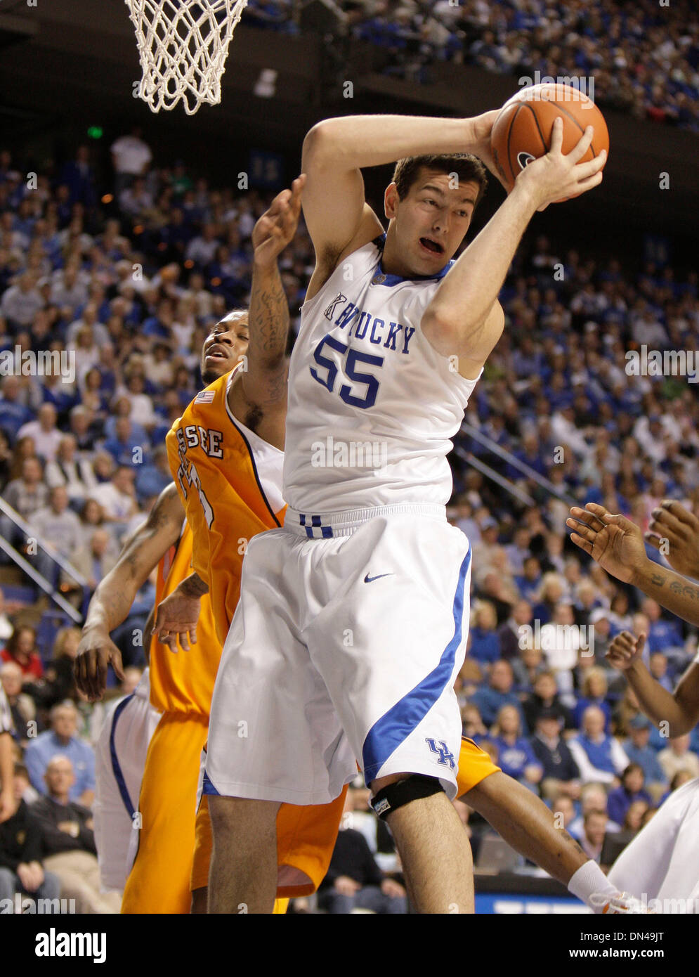 UK's Josh Harrellson grabbed a rebound in front of Tennessee's Bobby ...