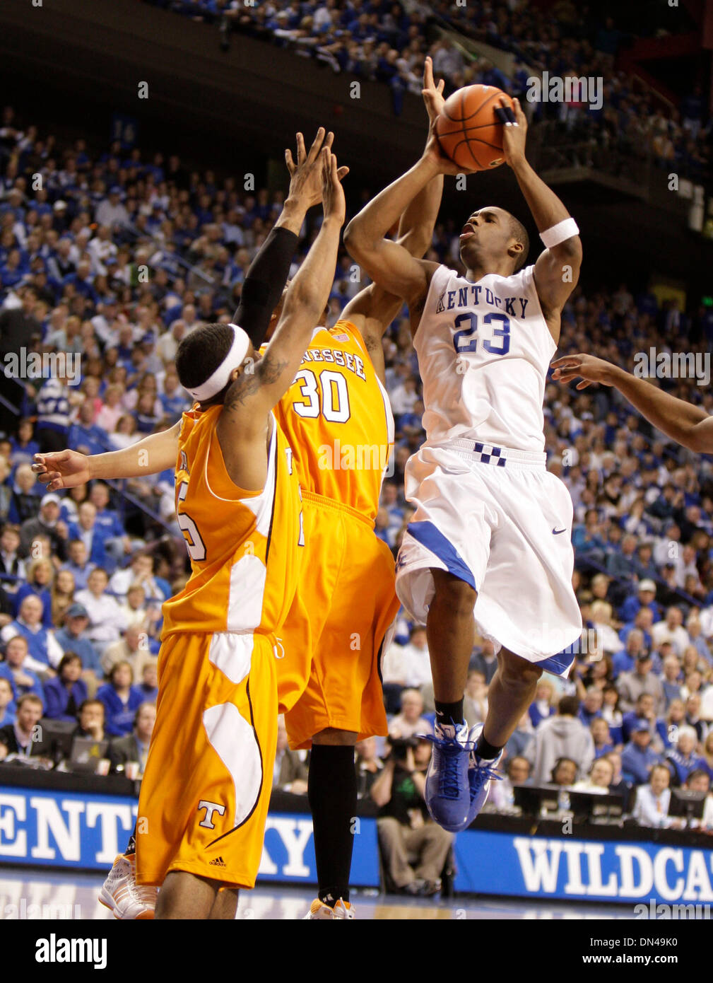 Tennessee's Josh Tabb, left, and J.P. Prince (30) tried to stop UK's ...