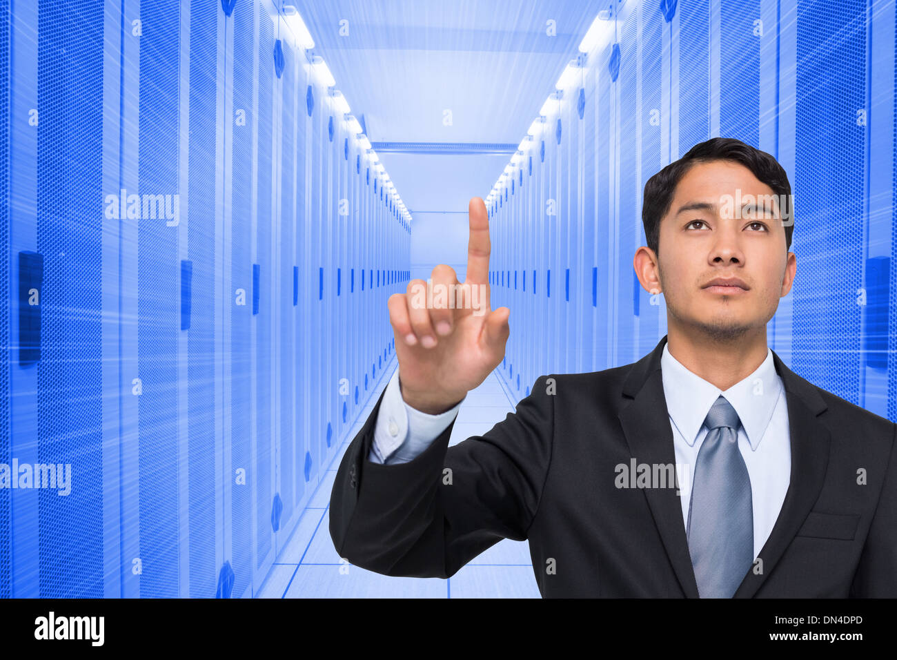 Composite image of stern asian businessman pointing Stock Photo - Alamy