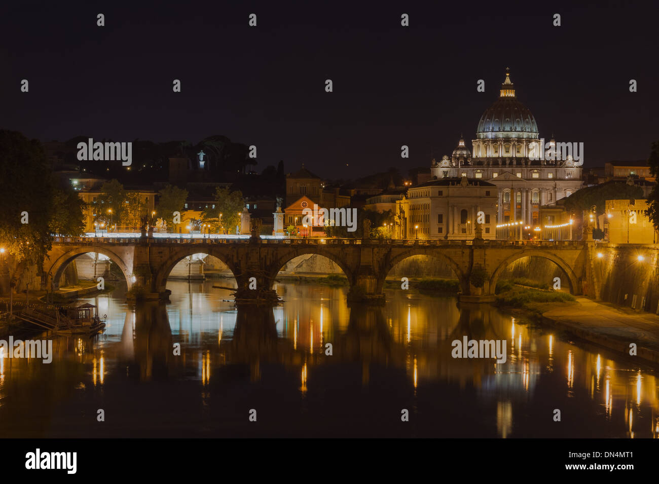 Saint Peter's Basilica and the Sant'Angelo Bridge illuminated at night ...