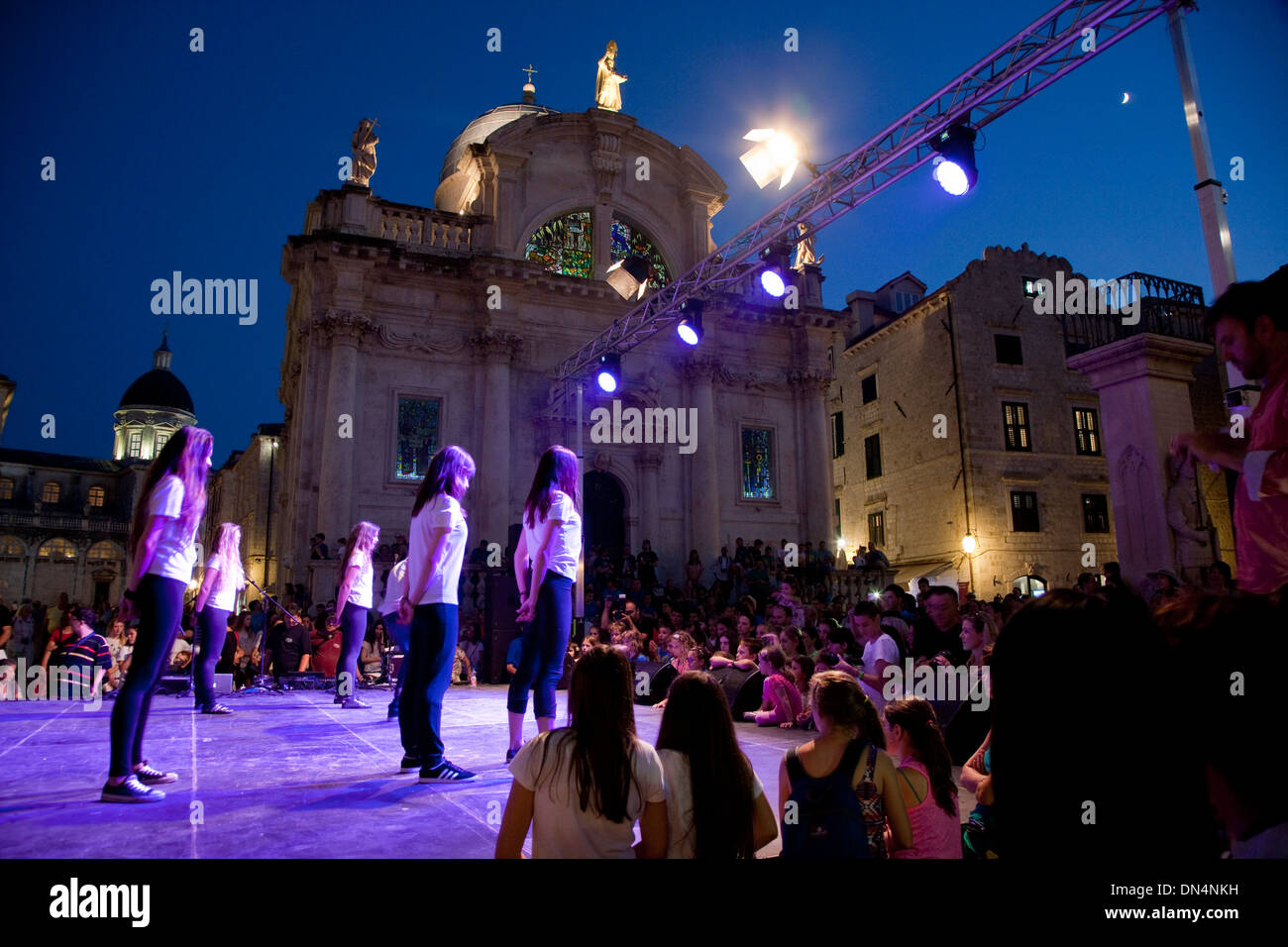 Dubrovnik, Croatia. Night scene in the old town with singer and dancers ...