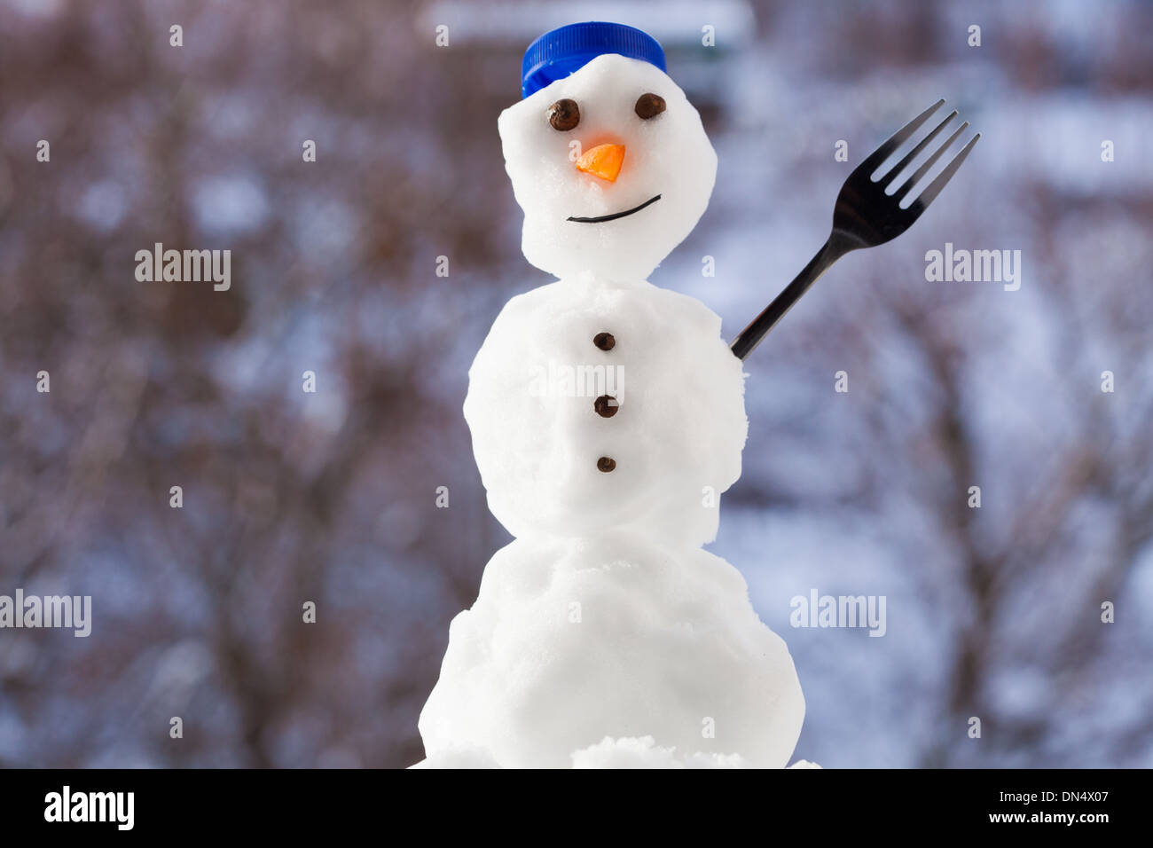 Christmas. Little funny snowman with fork as hand outdoor. Sky ...