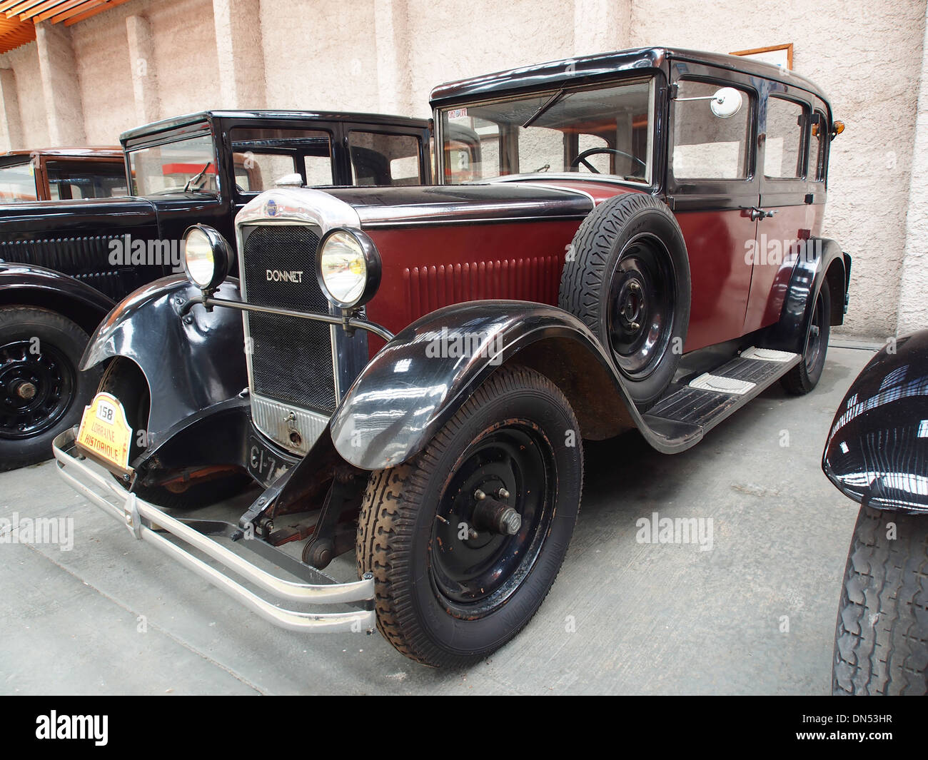 The Donnet automobile, featuring a distinctive red and black color ...