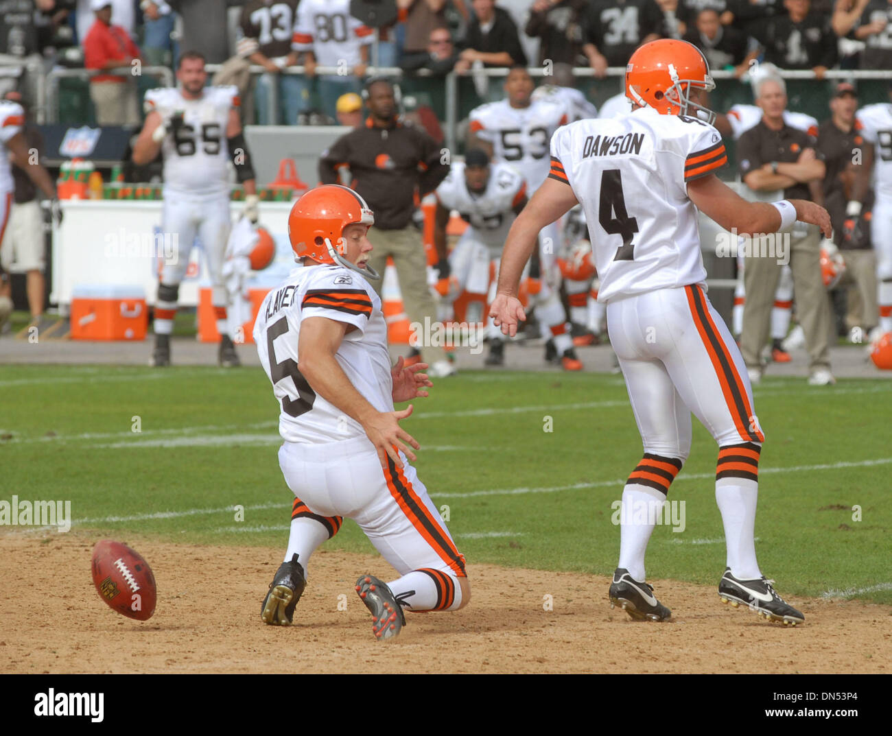 Cleveland Browns holder, Scott Player watches the ball bounce by him ...