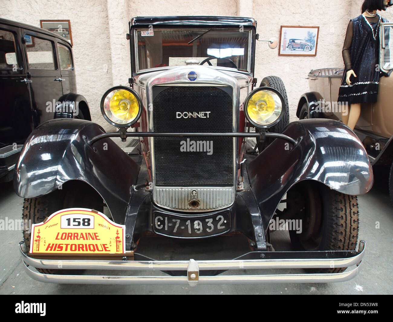 The Donnet, a classic red and black automobile, represents a unique ...