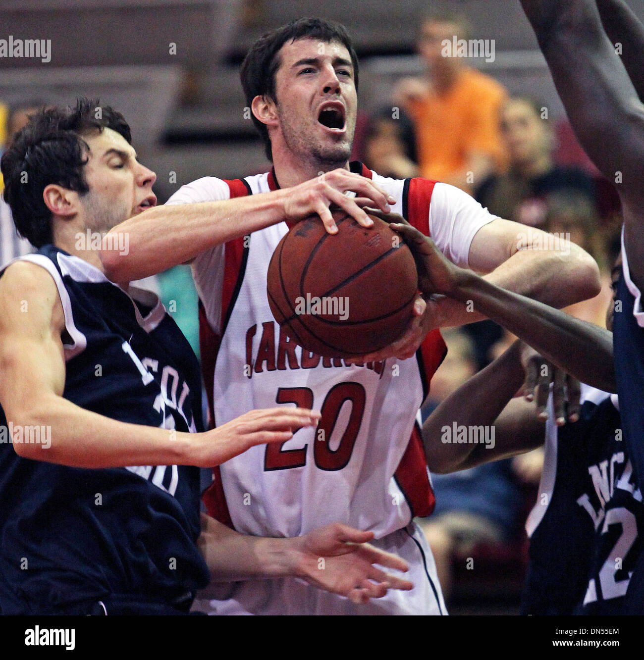 SPORTS Cardinlas guard Garrett Bell draws a foul under the basket as ...