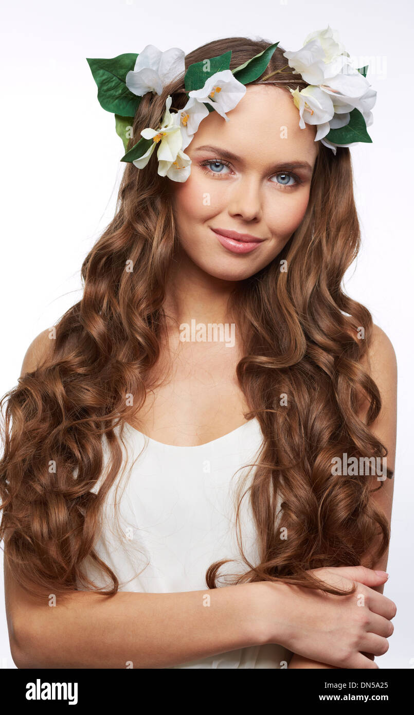 Charming young woman giving a look to the viewer, isolated on white ...