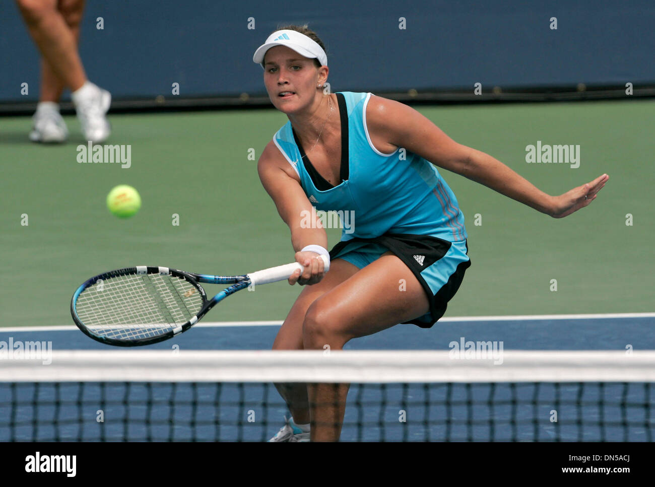 Aug 02, 2006; Carlsbad, CA, USA; ASHLEY HARKLEROAD goes to the net ...