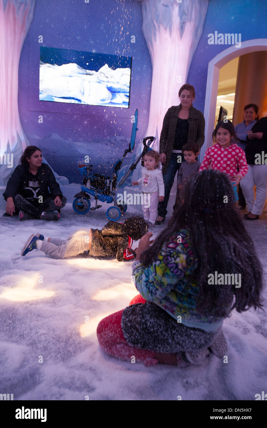 Children playing in fake snow in The Ice Palace Christmas display at ...