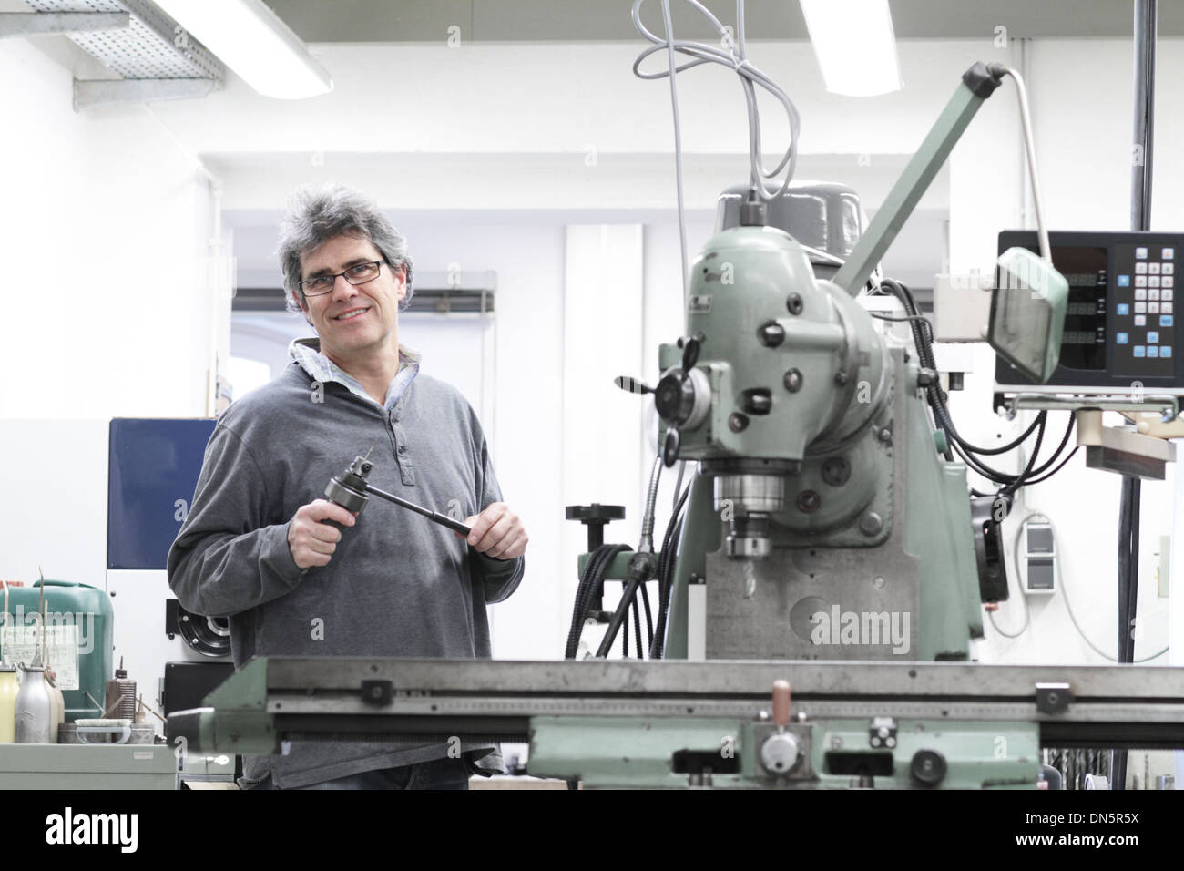 A technical worker engineer is working in factory or workshop Stock ...