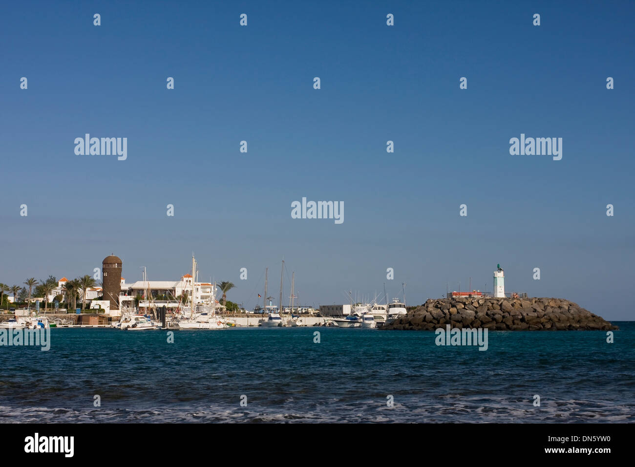 Marina with lighthouse in Caleta de Fuste, Fuerteventura, Canary ...