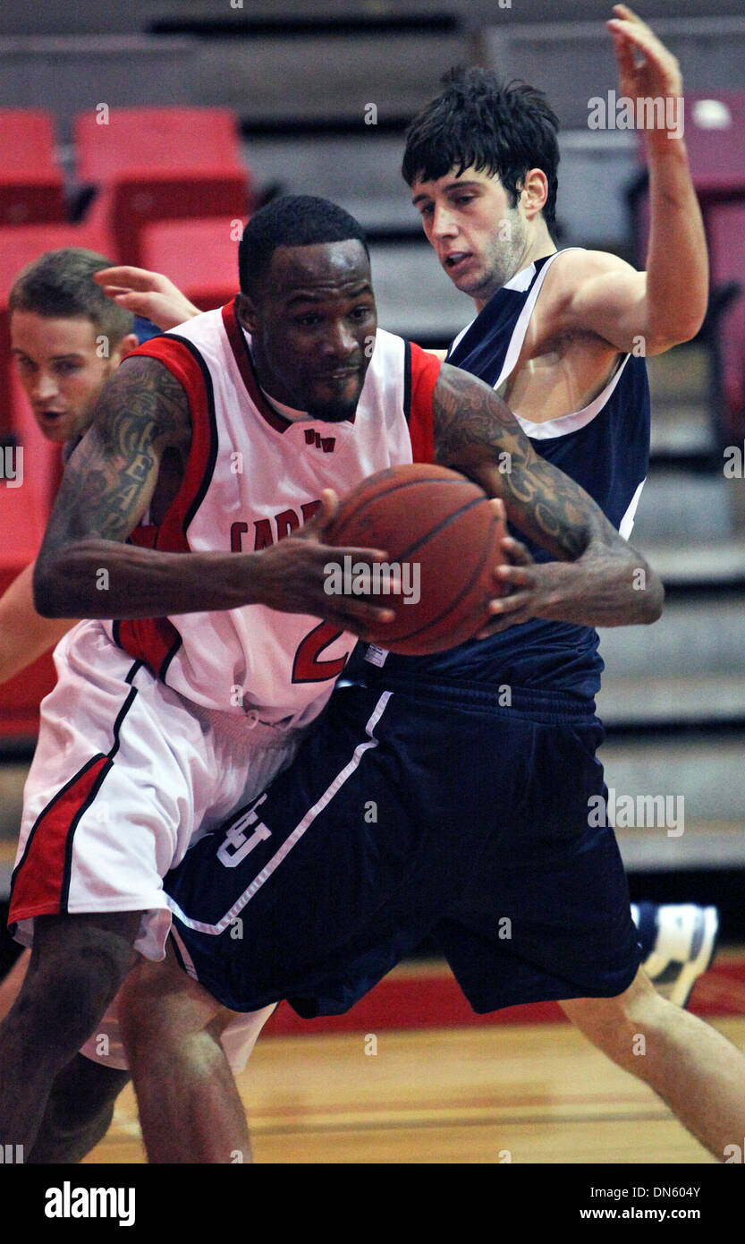 SPORTS Cardinals forward Jawan Bailey turns under the basket against ...