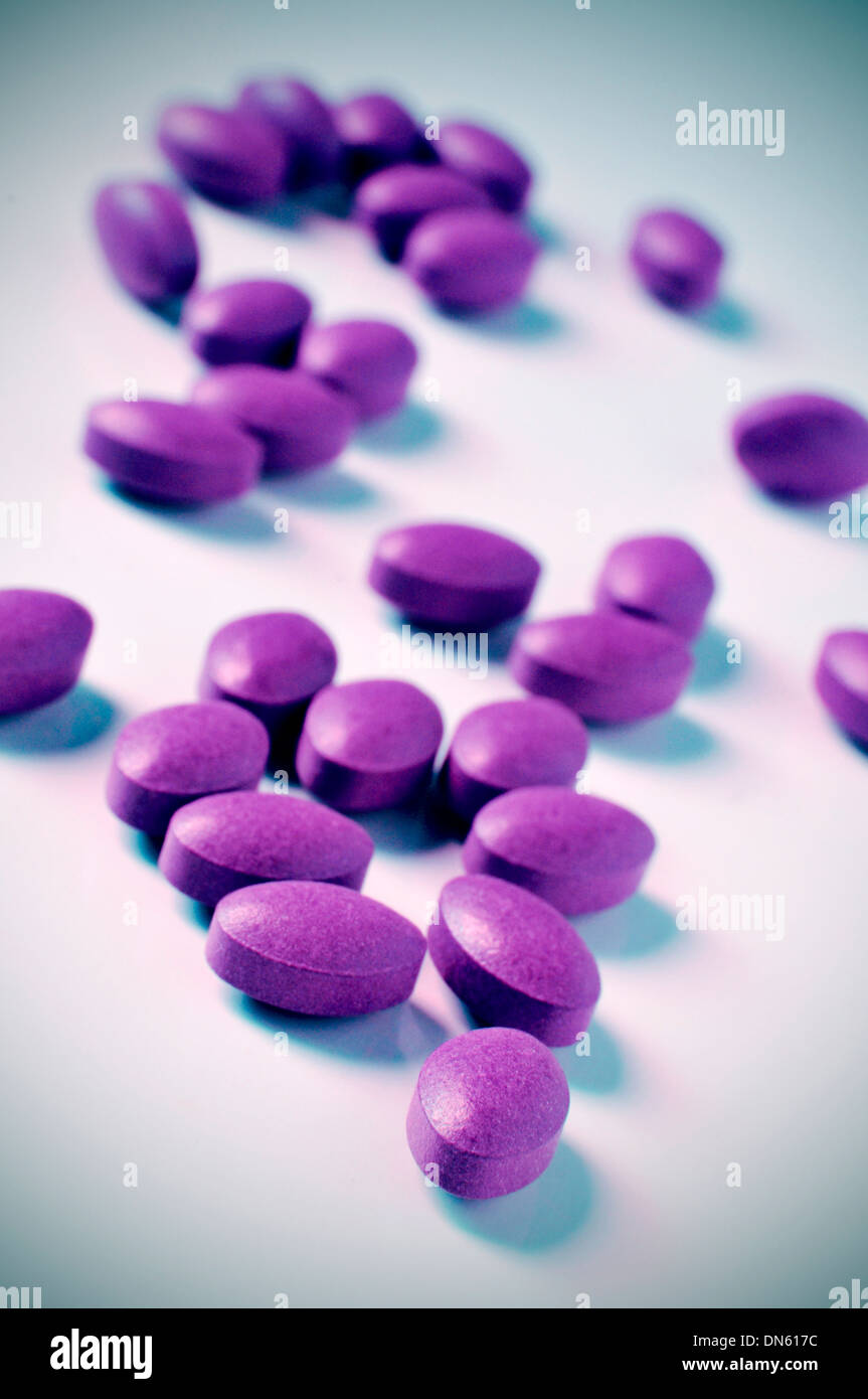 a pile of violet pills Stock Photo - Alamy