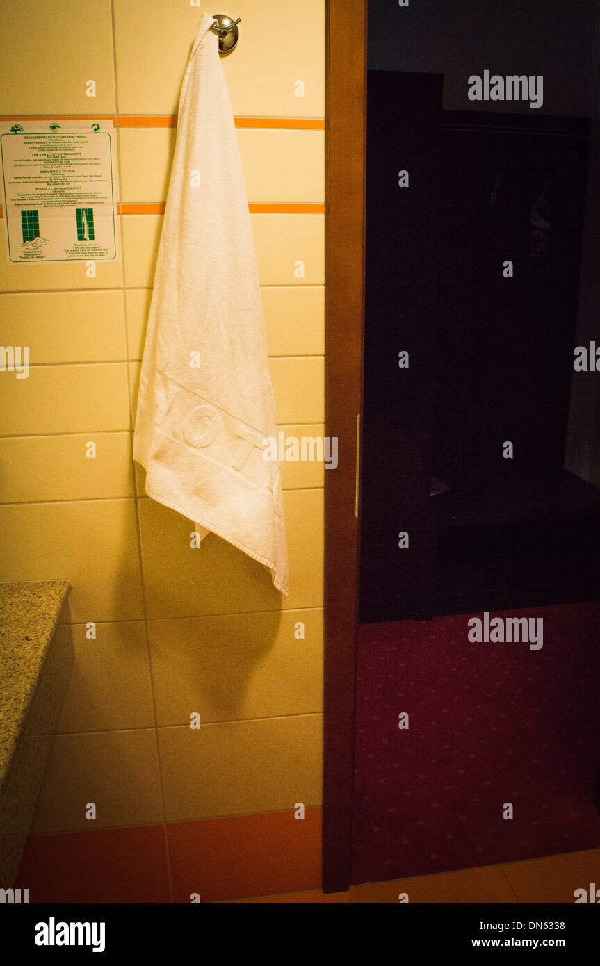 hotel, bathroom, bath room, bath towel on the wall hook, sign FOR A ...