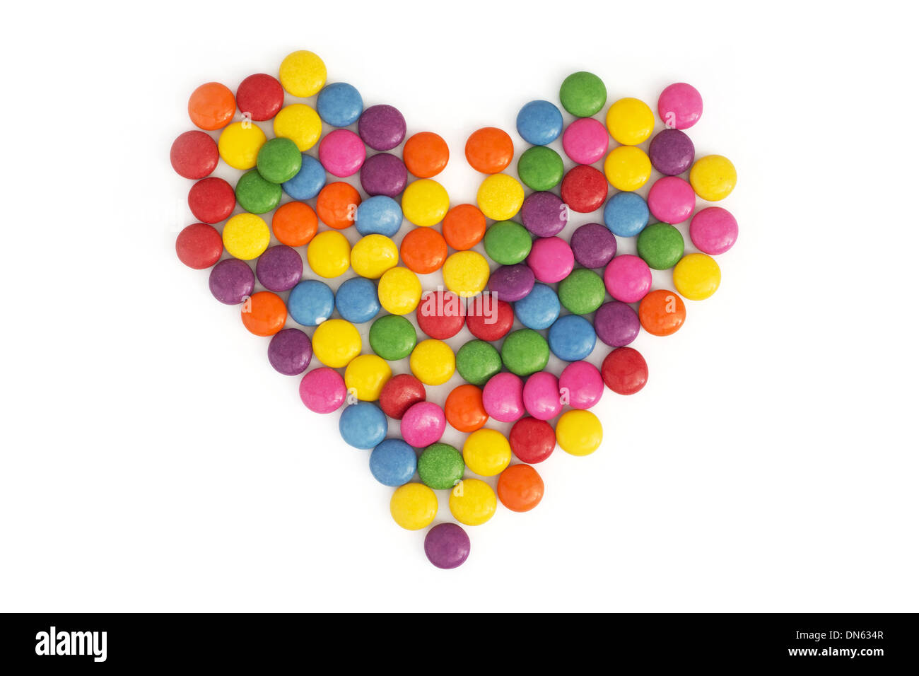 Heart made of colored smarties on a white background Stock Photo - Alamy