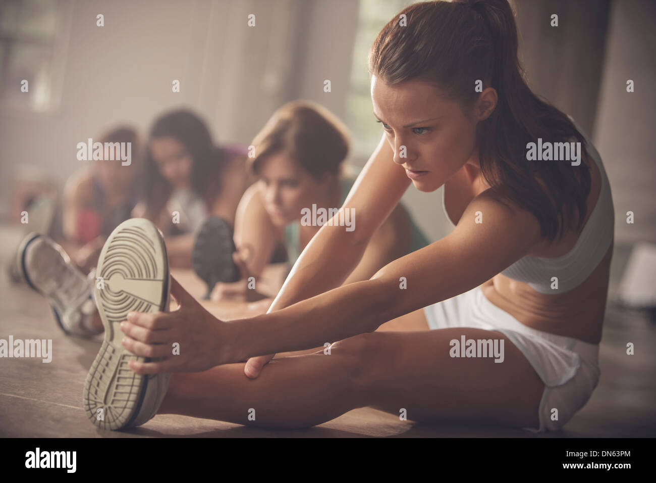 Women stretching in gym Stock Photo - Alamy