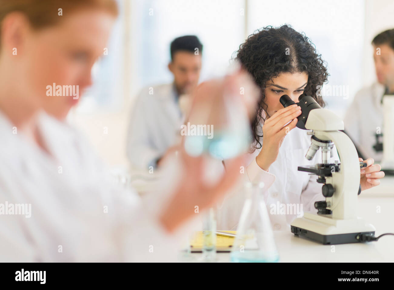 Scientist using microscope in laboratory Stock Photo - Alamy