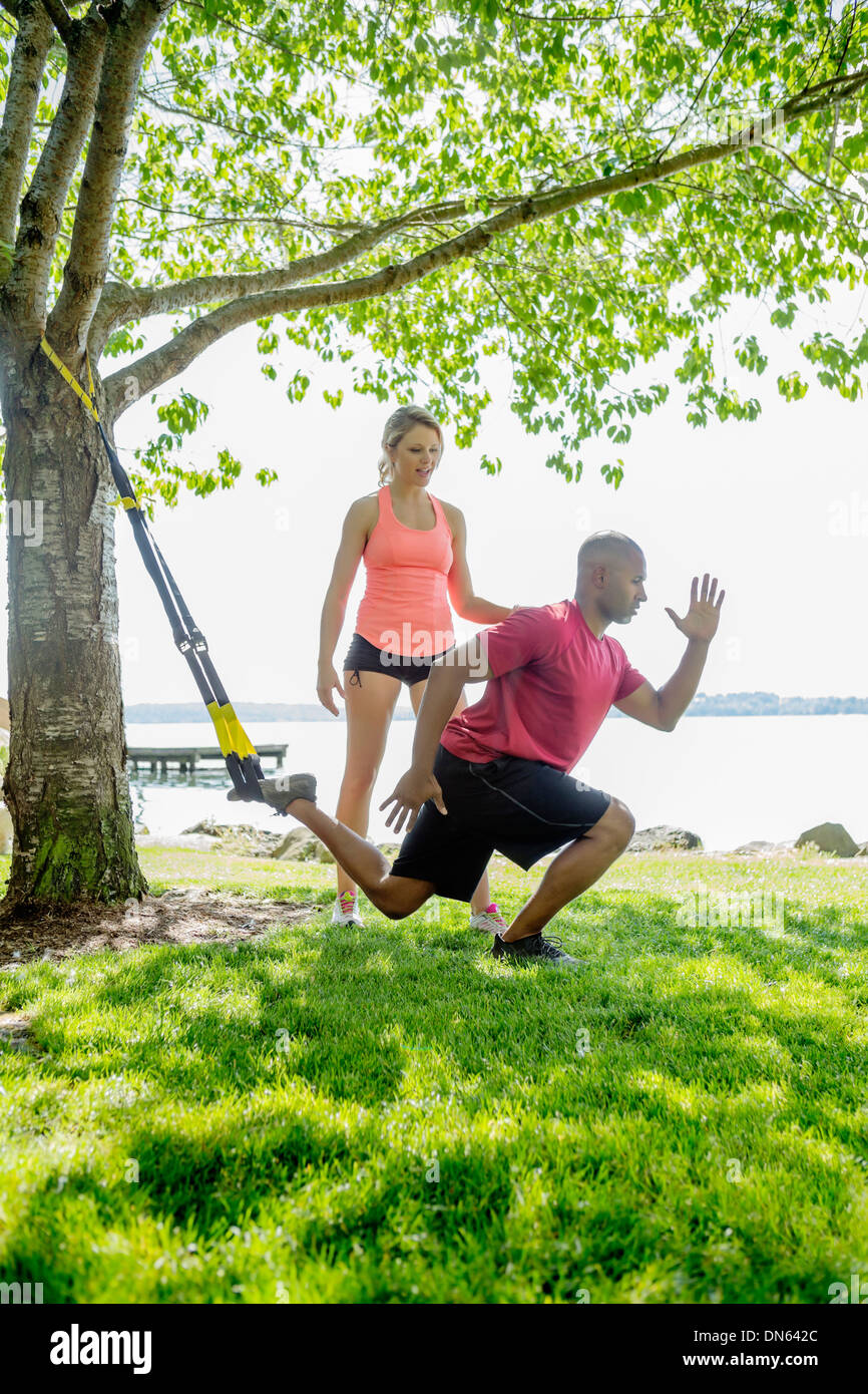Trainer watching man working out hi-res stock photography and images ...