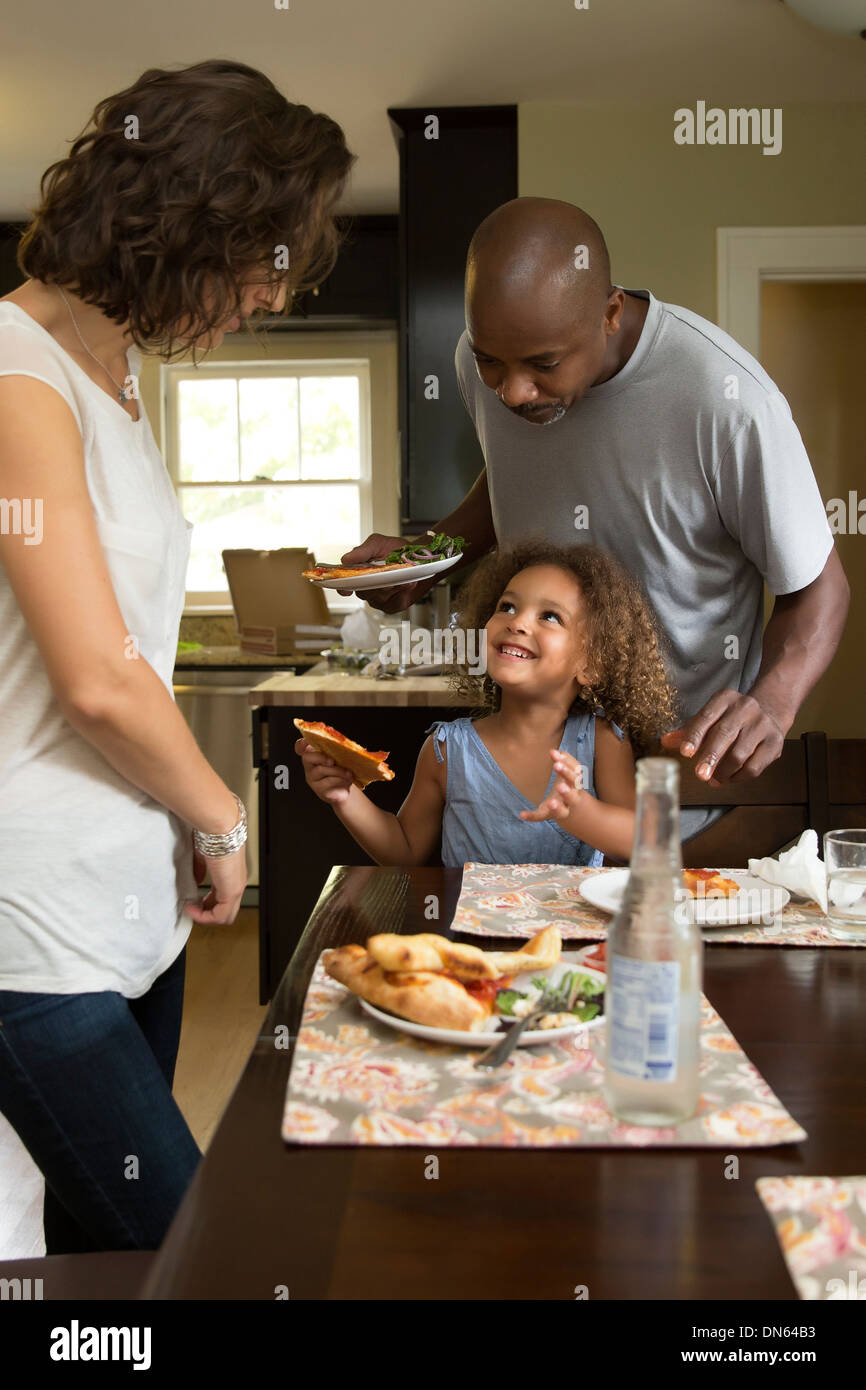 Family eating together at table Stock Photo - Alamy