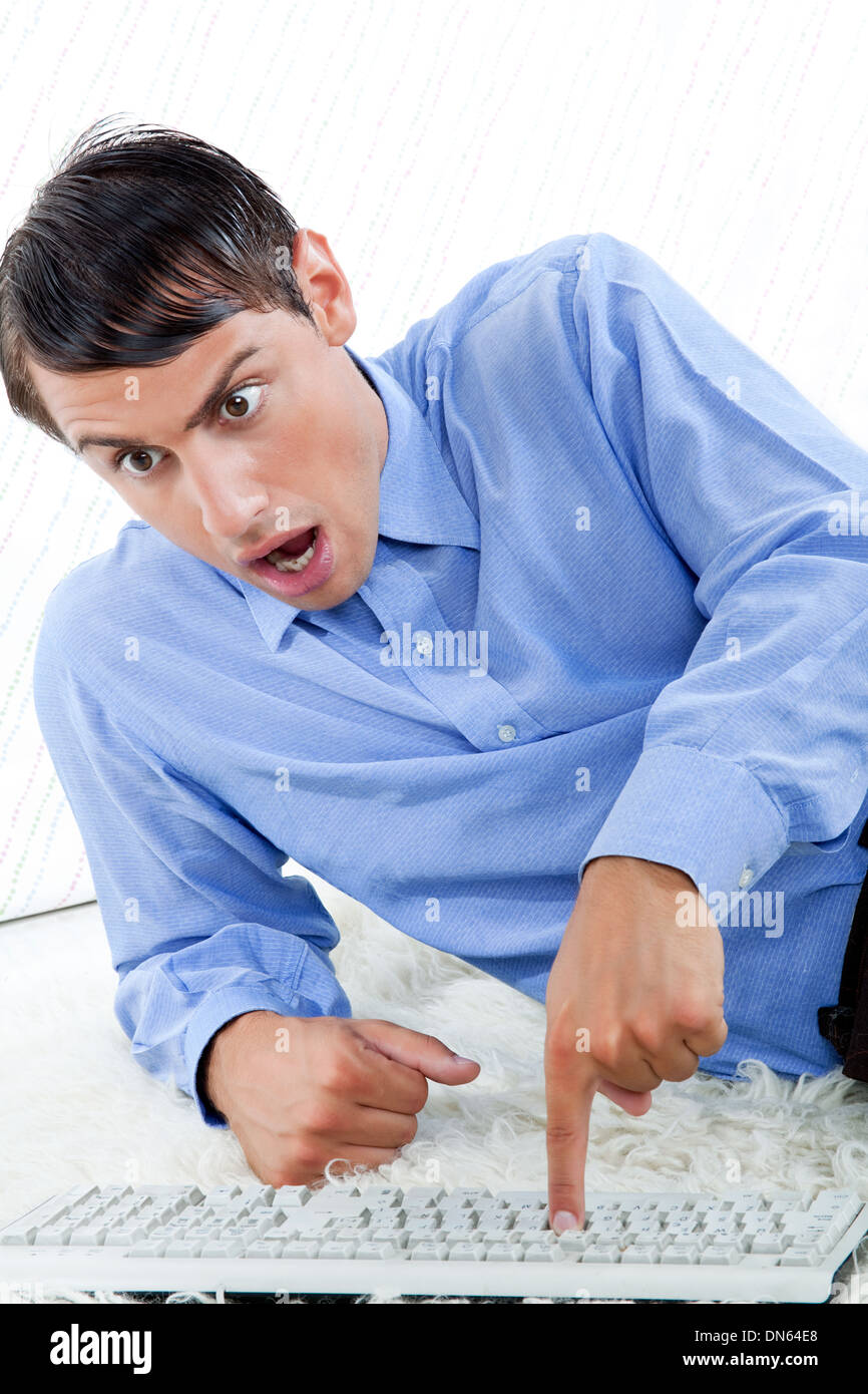Surprised Man with Keyboard Stock Photo - Alamy