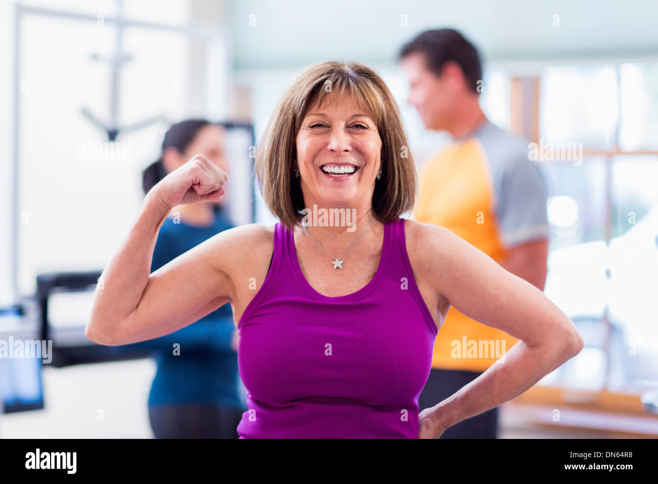 Women flexing muscles in gym hi-res stock photography and images - Alamy