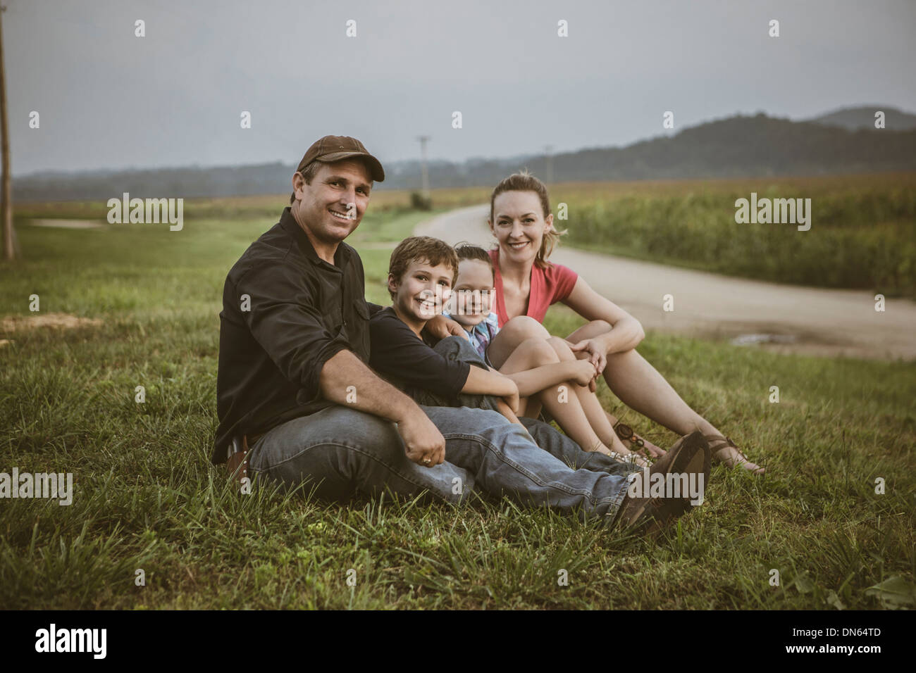 Caucasian family overlooking crop fields Stock Photo - Alamy