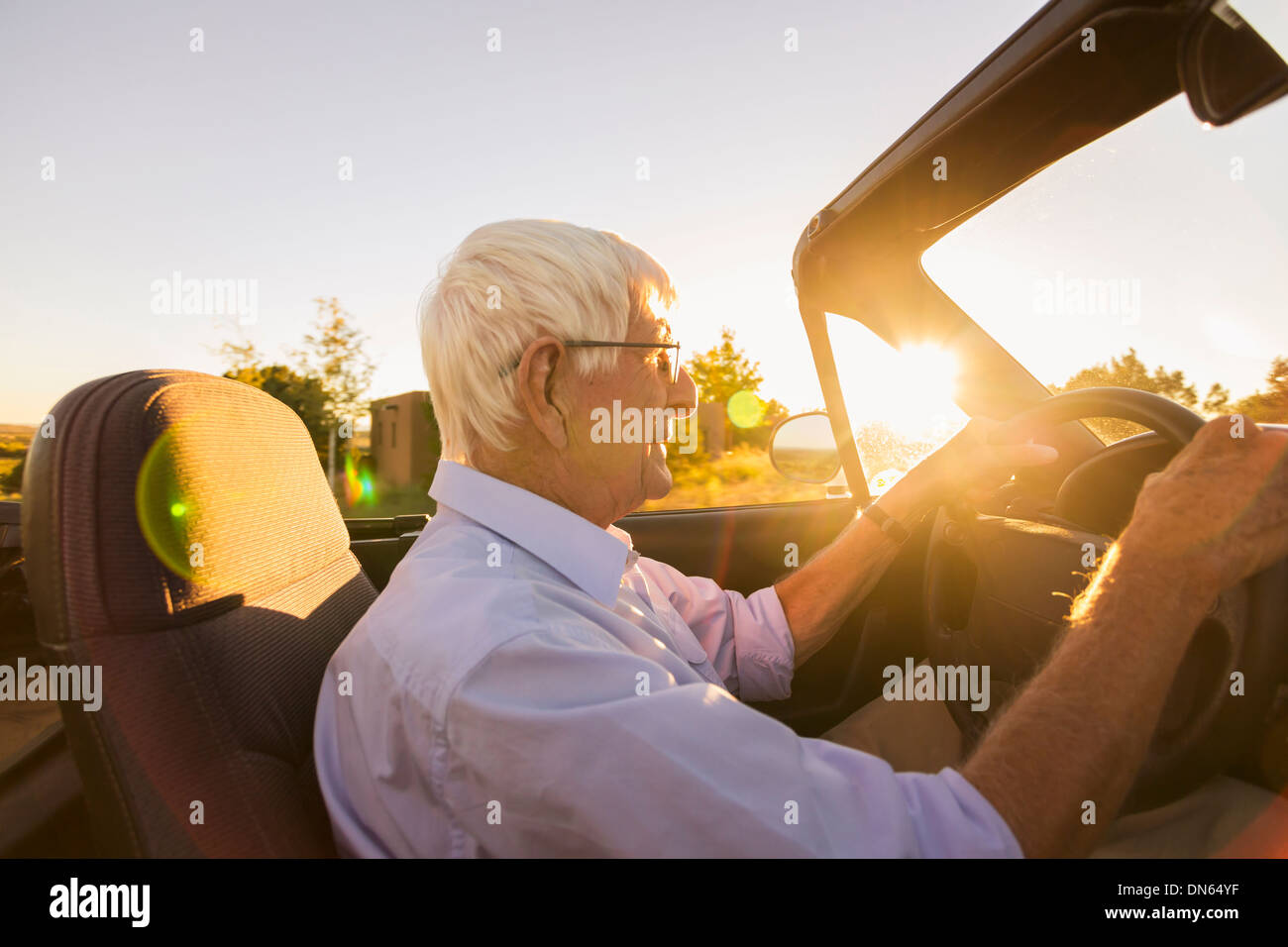 Senior Caucasian man driving convertible Stock Photo - Alamy