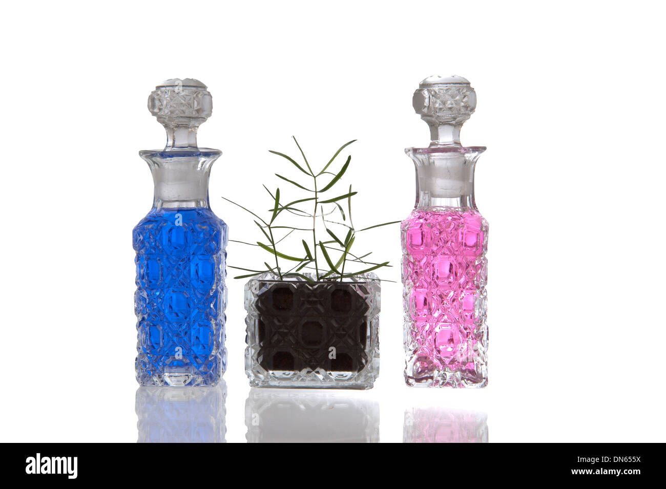 Blue and pink crystal glass bottles with decorative facet structure and ...