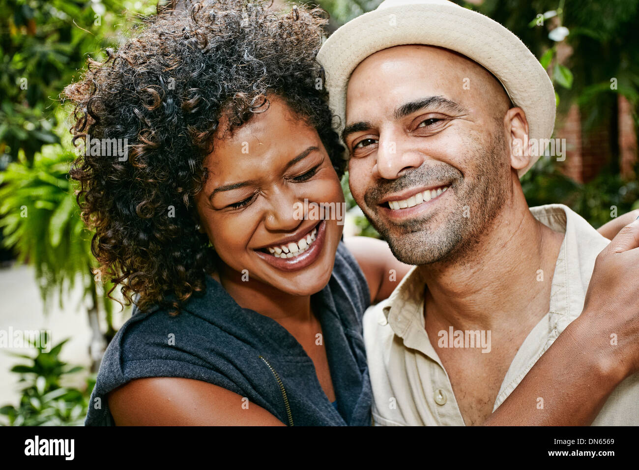 Couple smiling together outdoors Stock Photo - Alamy