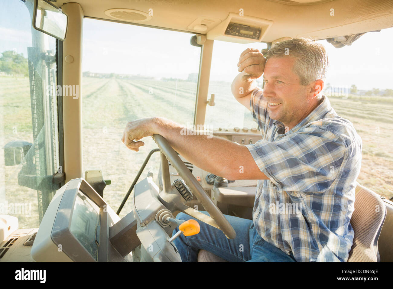 Happy farmer tractor hi-res stock photography and images - Alamy
