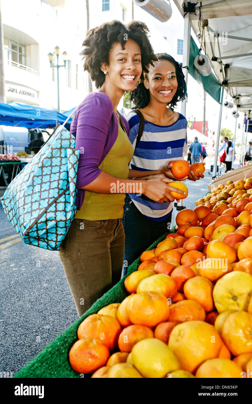 Women shopping together at fruit stand Stock Photo - Alamy